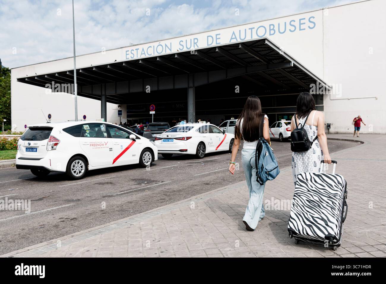People with suitcases leave the Mendez Alvaro bus station on August 1 ...