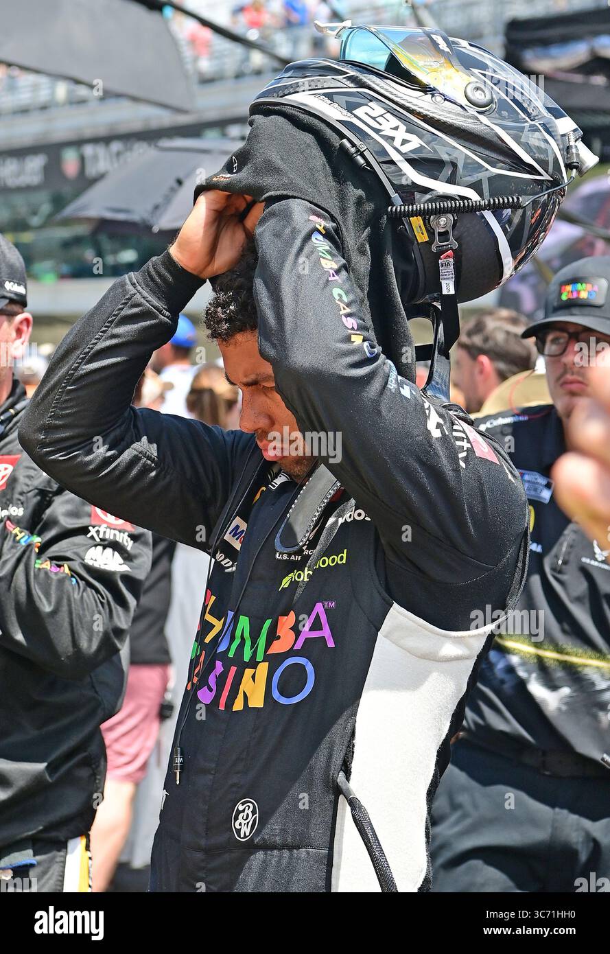 NASCAR Driver Bubba Wallace straps on his race helmet for the Brickard ...