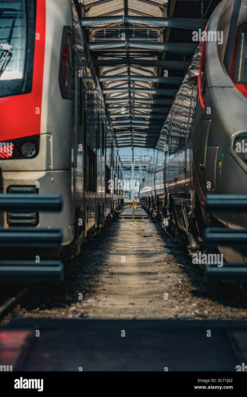 Symmetrical composition of two modern trains parked at Zurich train ...