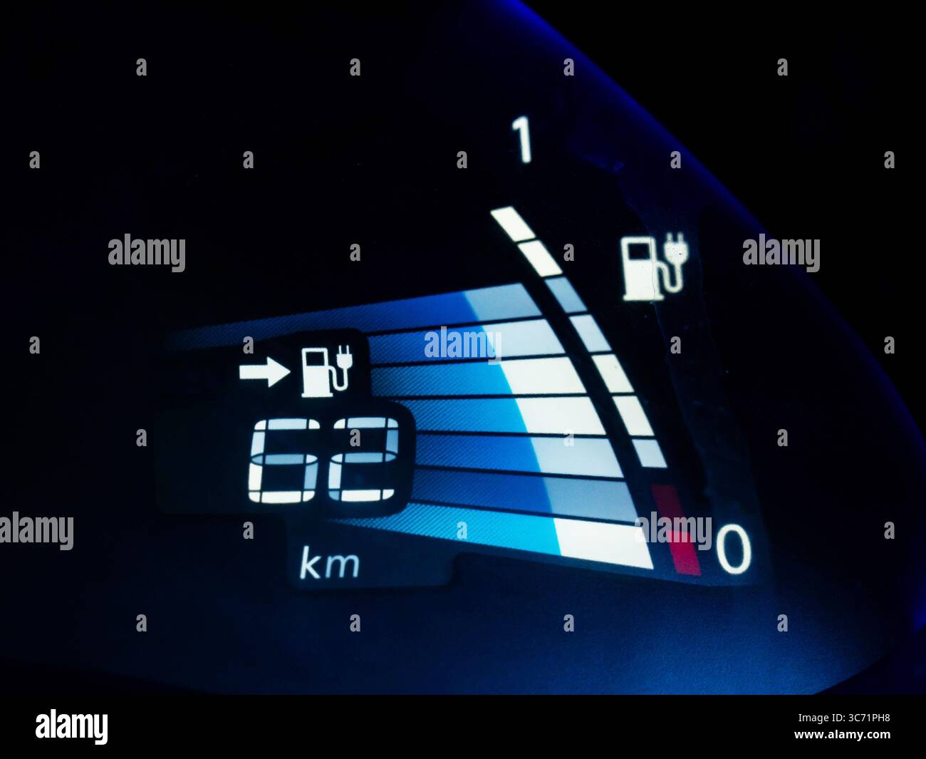 Electric car panel. Remaining battery charge in km Stock Photo - Alamy