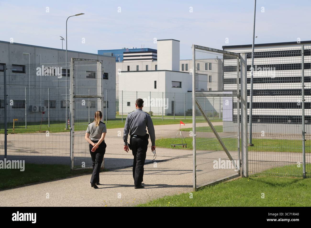 FILED - 30 July 2025, Estonia, Tartu: Two prison guards walk through an ...