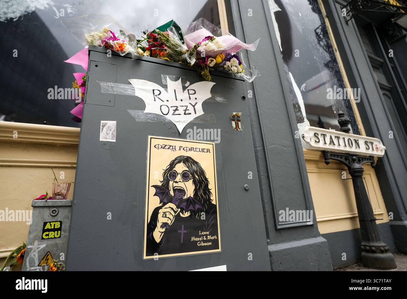 Station Street, Birmingham, 1st August 2025: People take pictures at a shrine below the image of ...