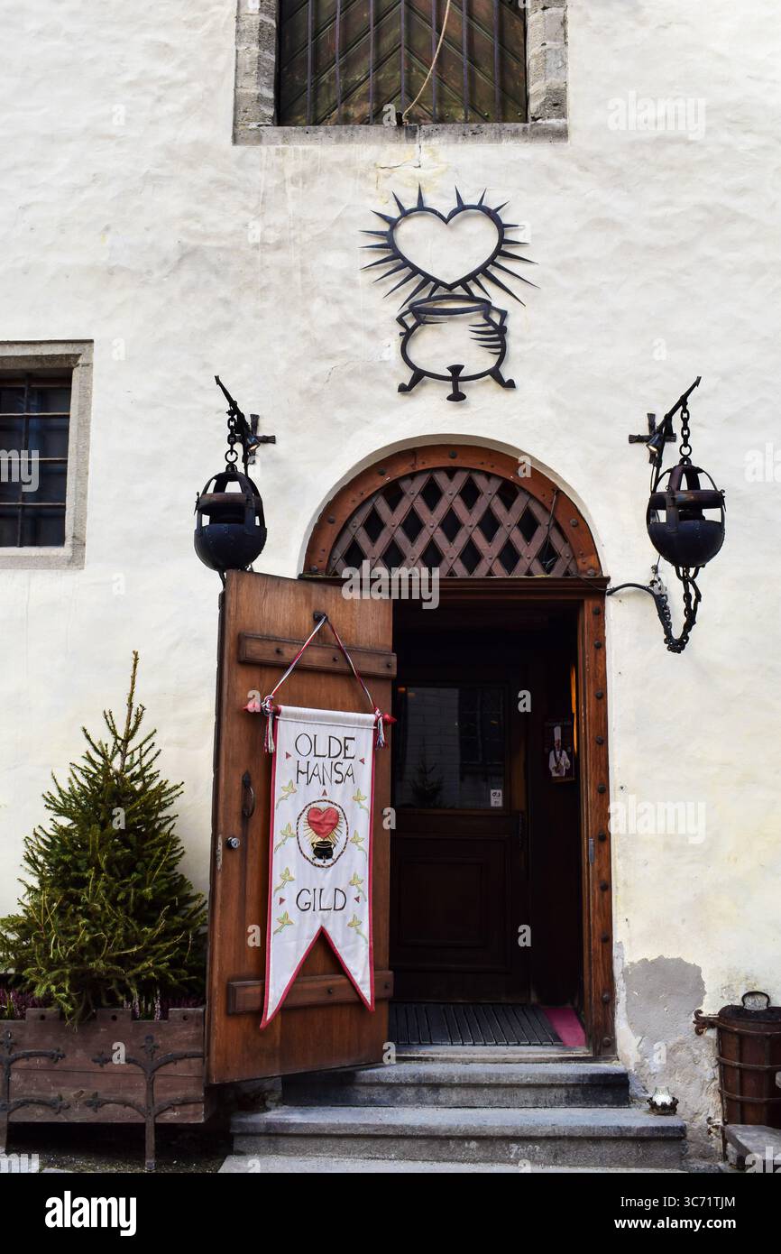 Olde Hansa Restaurant Entrance with Gilded Guild Banner Stock Photo - Alamy