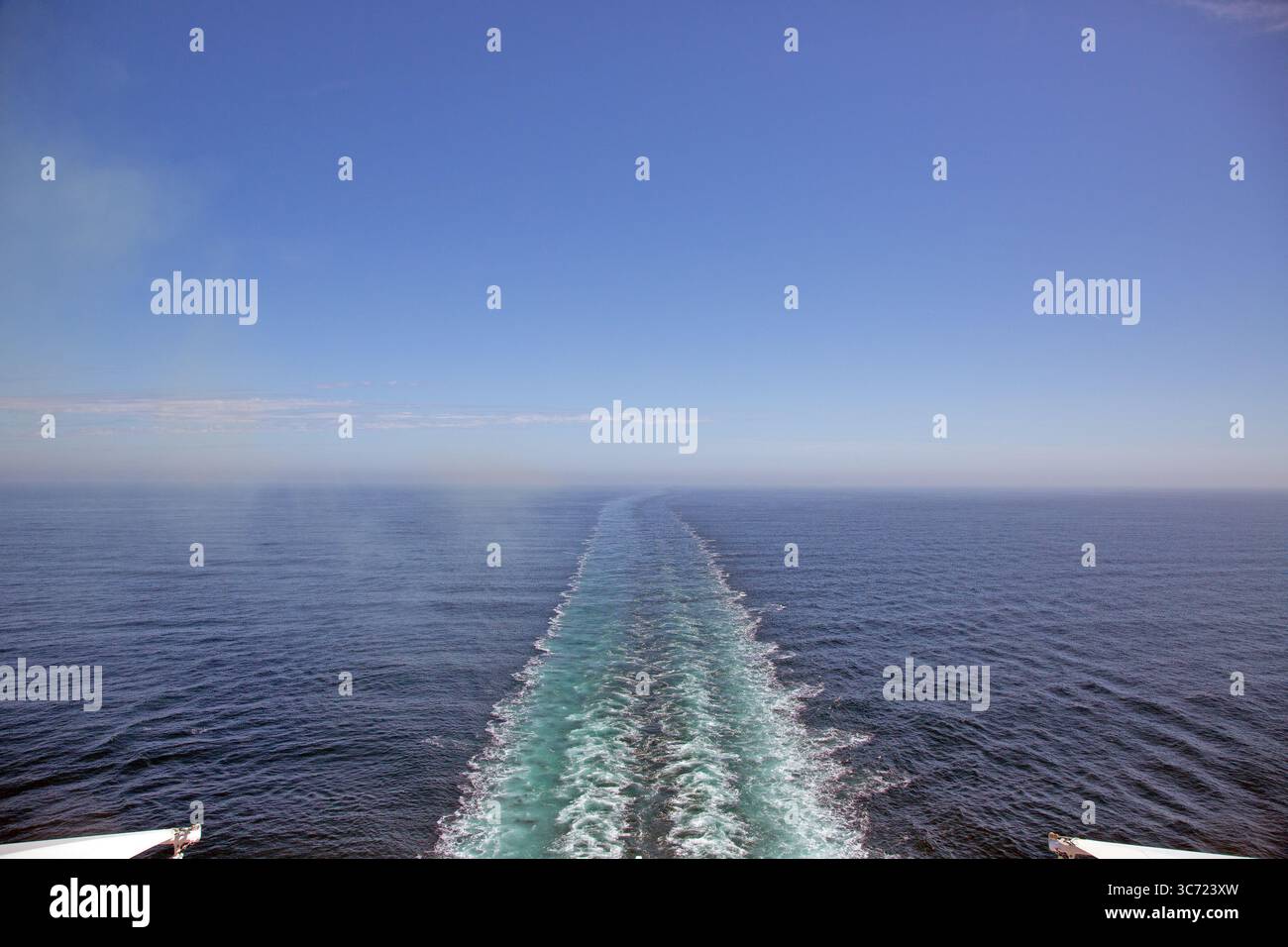View from ship deck looking over blue Baltic Sea wake and horizon with ...