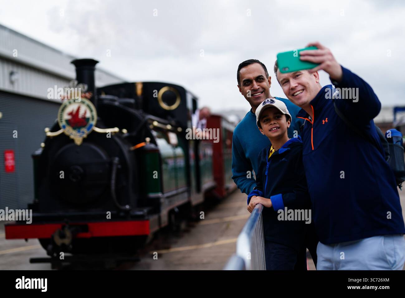 Visitors take a selfie by The Prince, a steam locomotive built for the ...