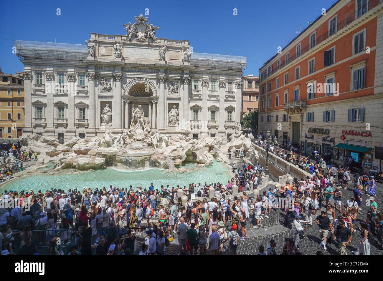 Rome, Italy. 1 August 2025 Large crowds of tourists gather around the ...