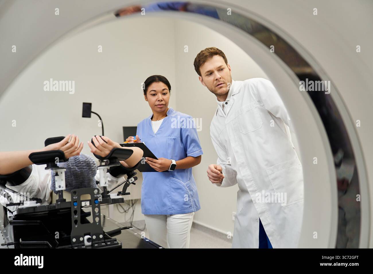 Healthcare team supports patient hi-res stock photography and images ...