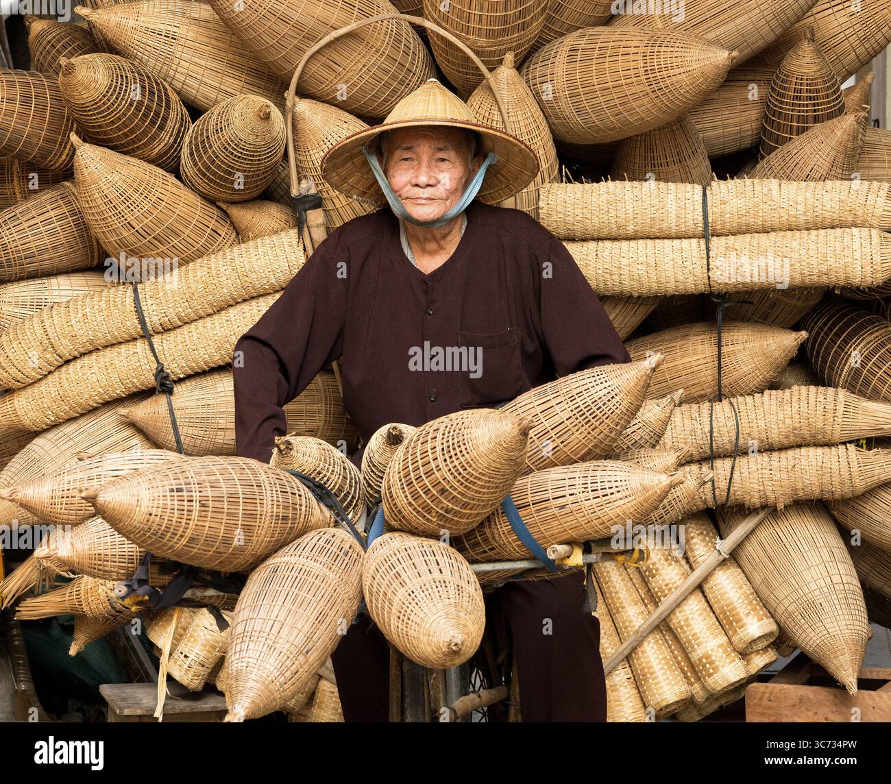 Traditional bamboo trap makers at work, preserving a centuries-old ...