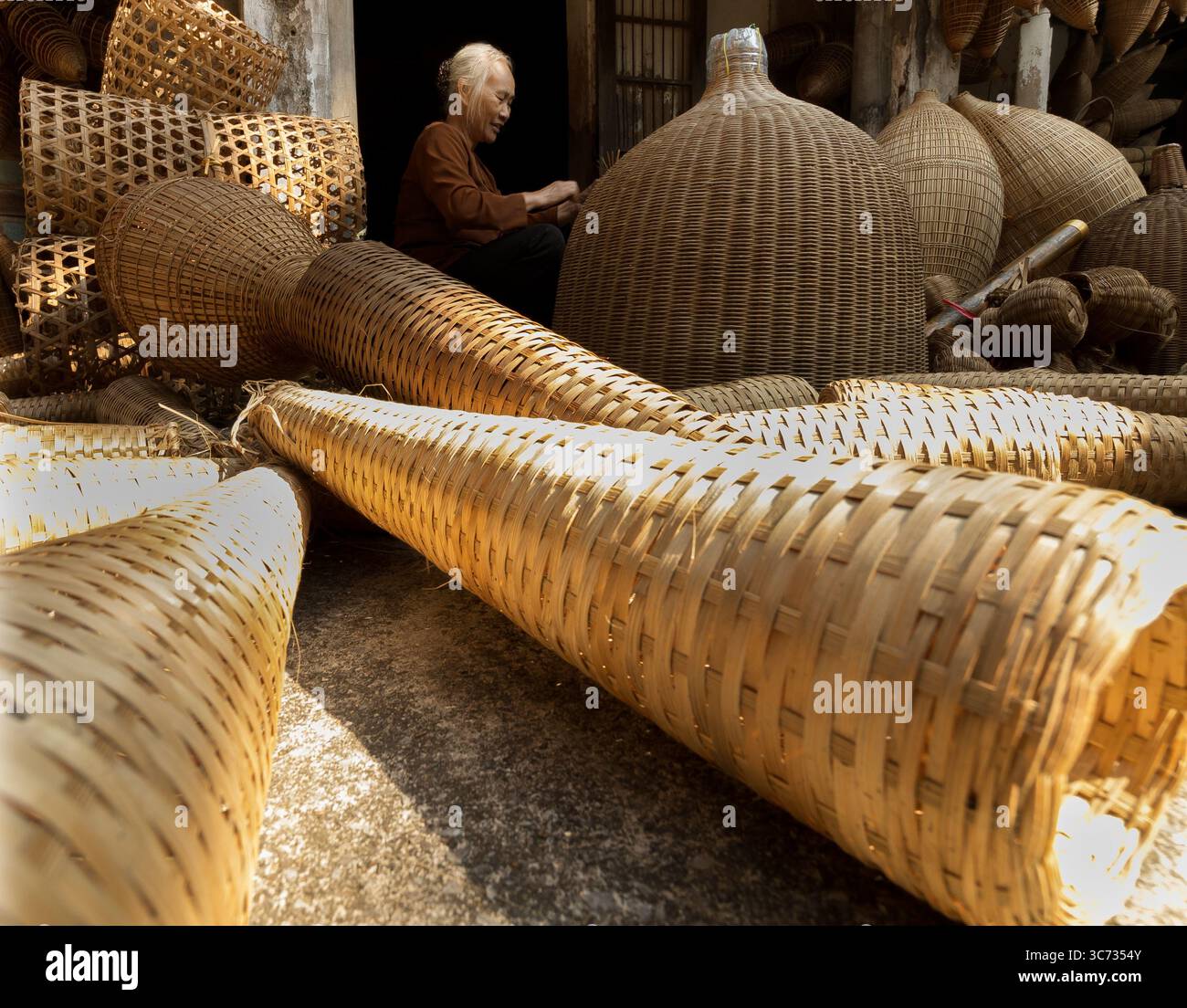 Traditional bamboo trap makers at work, preserving a centuries-old ...