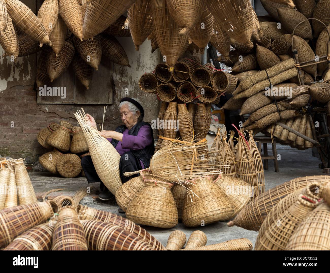 Traditional bamboo trap makers at work, preserving a centuries-old ...