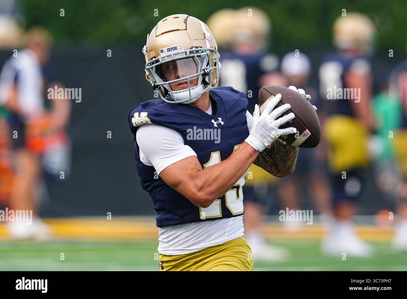 Notre Dame wide receiver Logan Saldate (19) makes a catch during NCAA college football practice ...