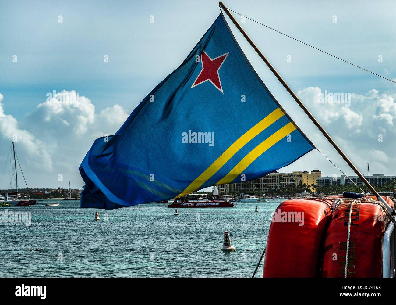 The flag of Aruba on the stern of a tourist boat Stock Photo - Alamy