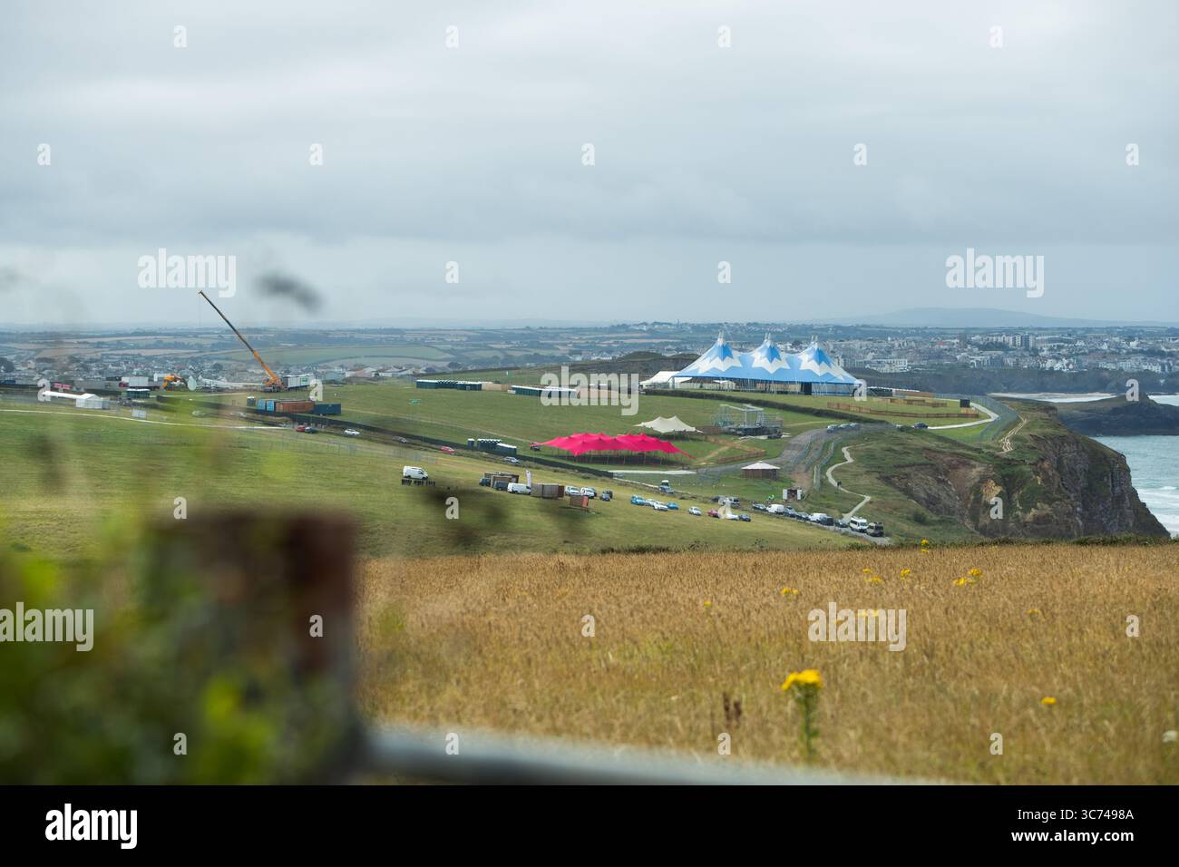 Tuesday 29th July 2025: Festival staff set up stages in the fields ...
