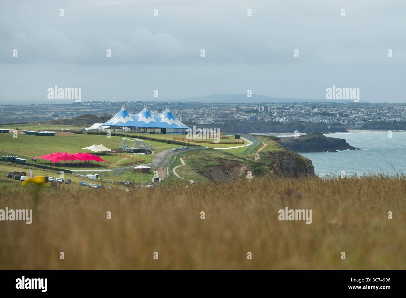 Tuesday 29th July 2025: Festival staff set up stages in the fields ...
