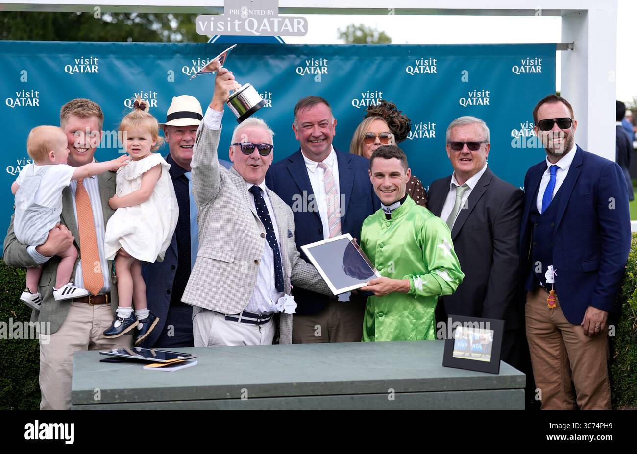 Jockey Jason Hart celebrates with the winning entourage after victory ...