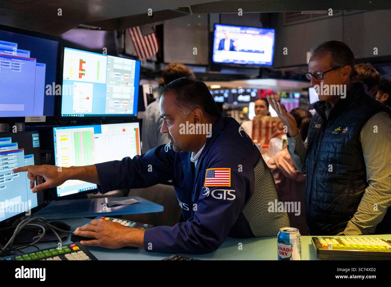Specialist Dilip Patel works on the floor of the New York Stock ...