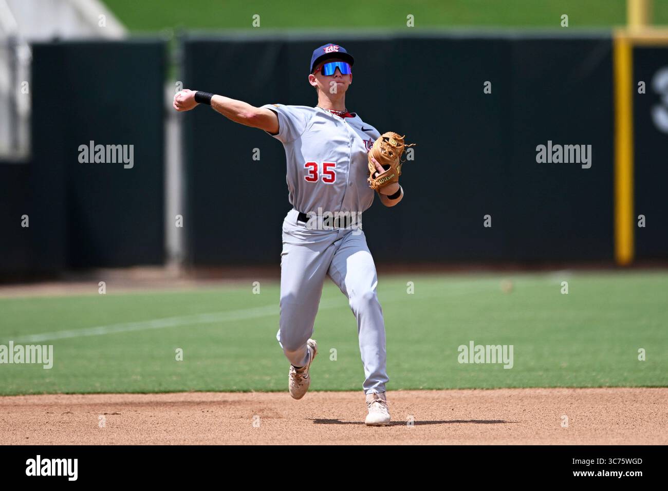 Alex Hernandez (35) (Georgia Tech) of Team Stripes throws to first base ...