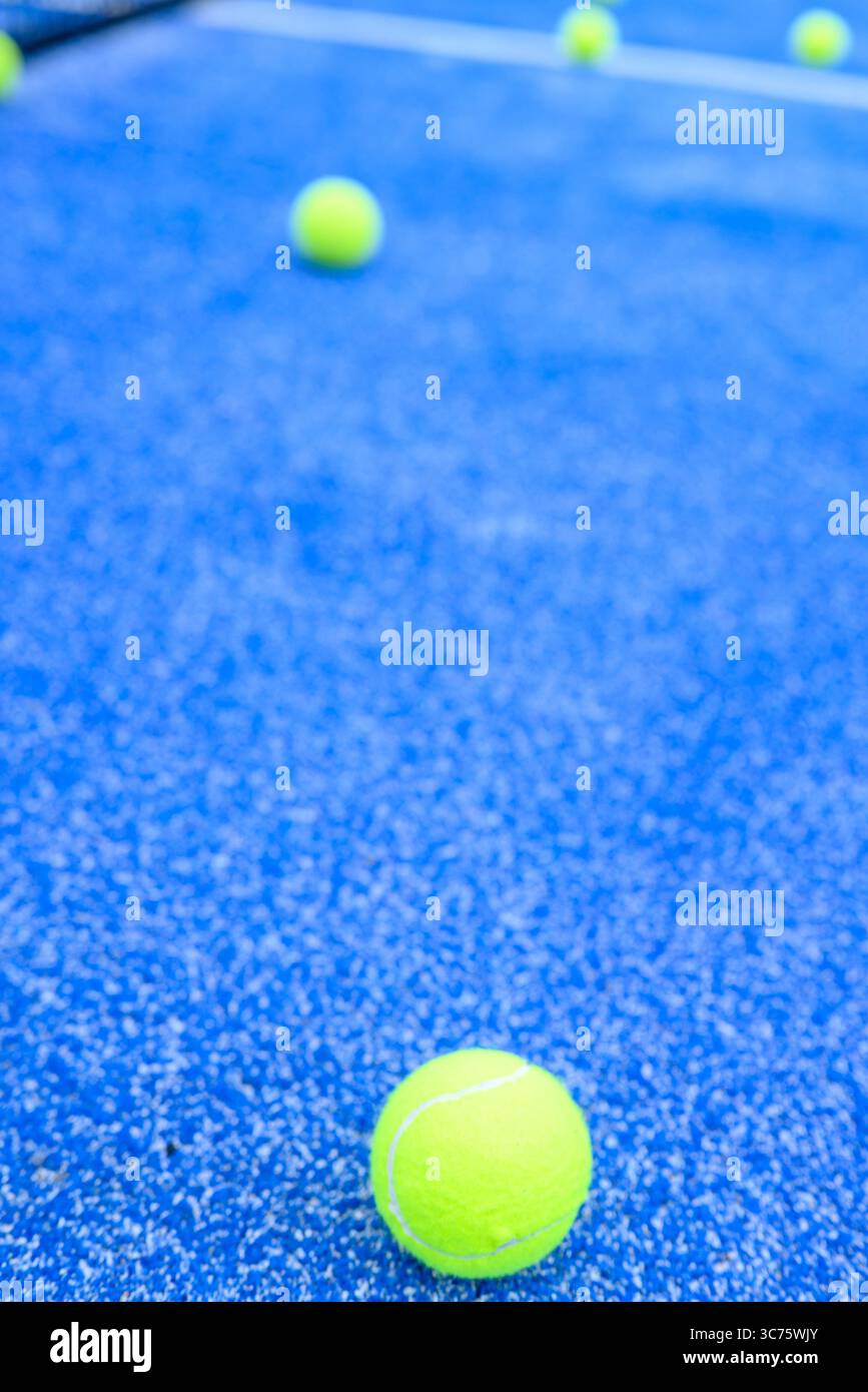 Padel court perspective with one ball in focus and others blurred Stock ...