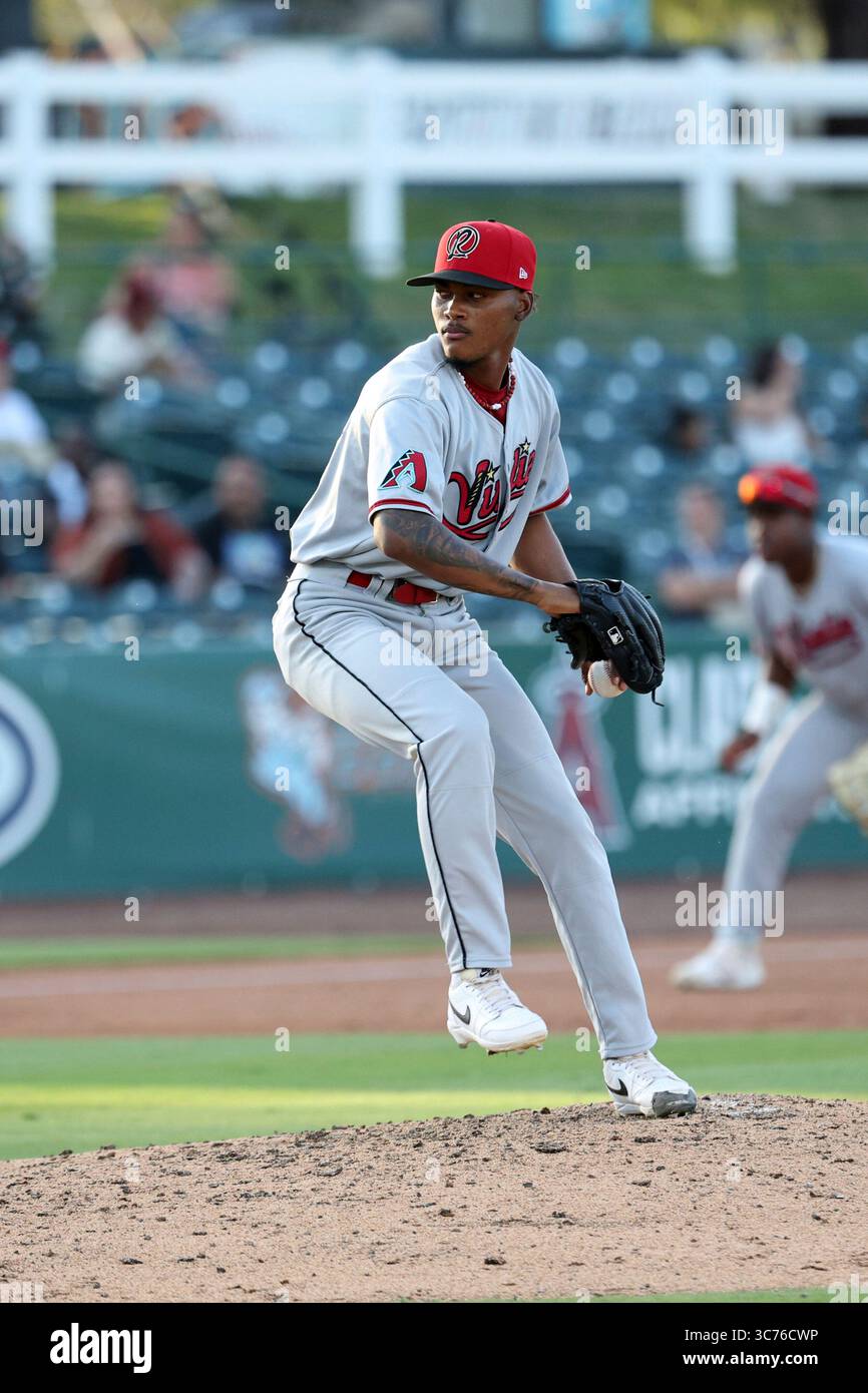 Sandro Santana (12) of the Visalia Rawhide pitches against the Inland ...