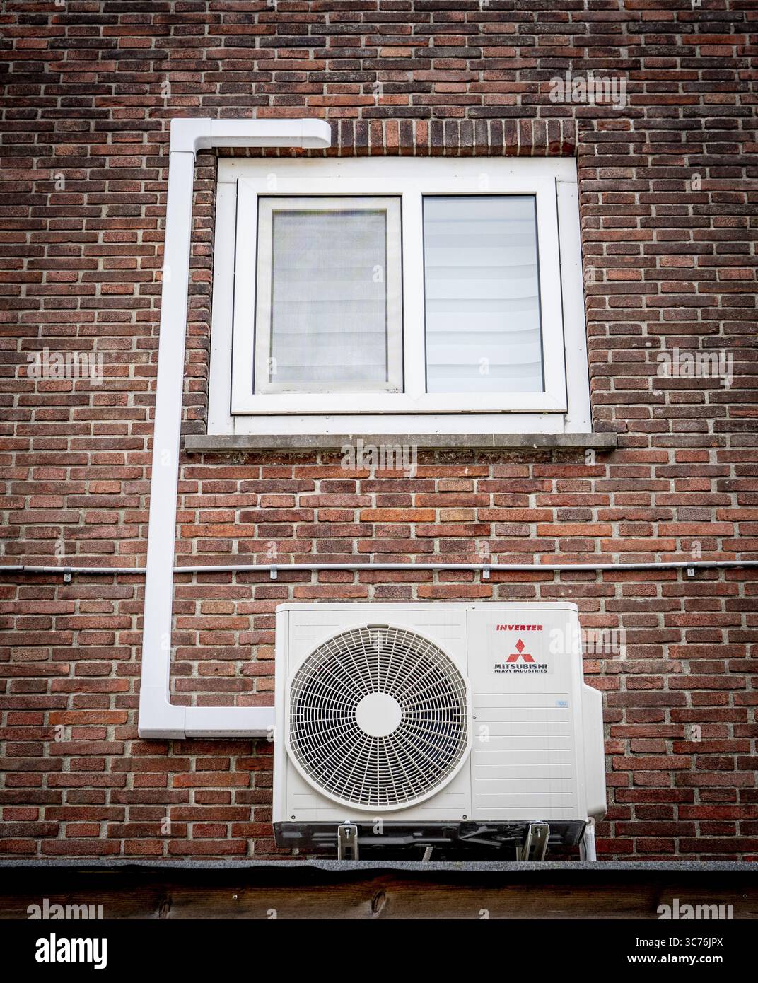 ROTTERDAM - An air conditioner on the outside of a home ANP /HOLLANDSE ...