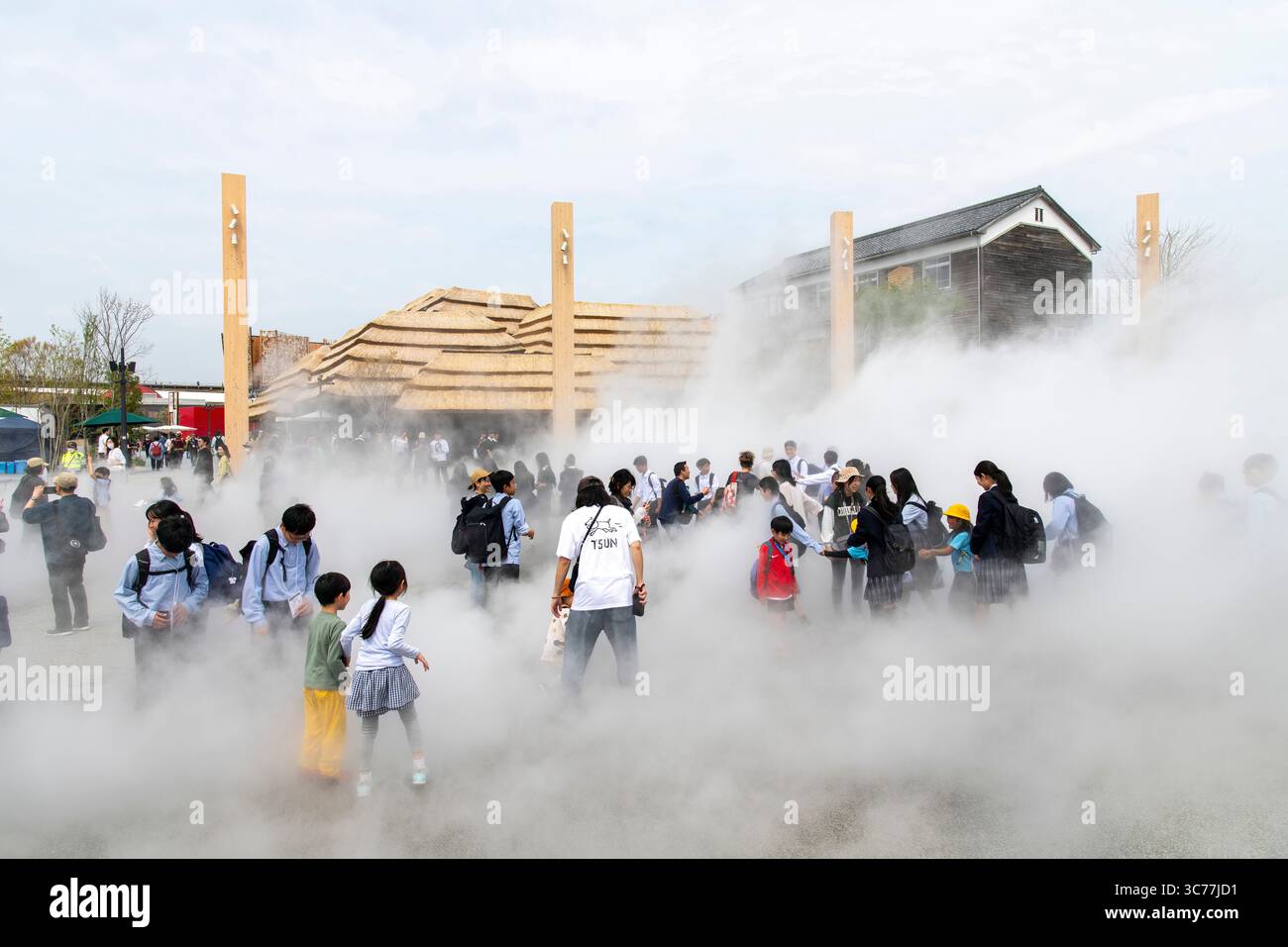 Osaka, Japan-18 April 2025; Visitors enjoying water and steam fountains ...