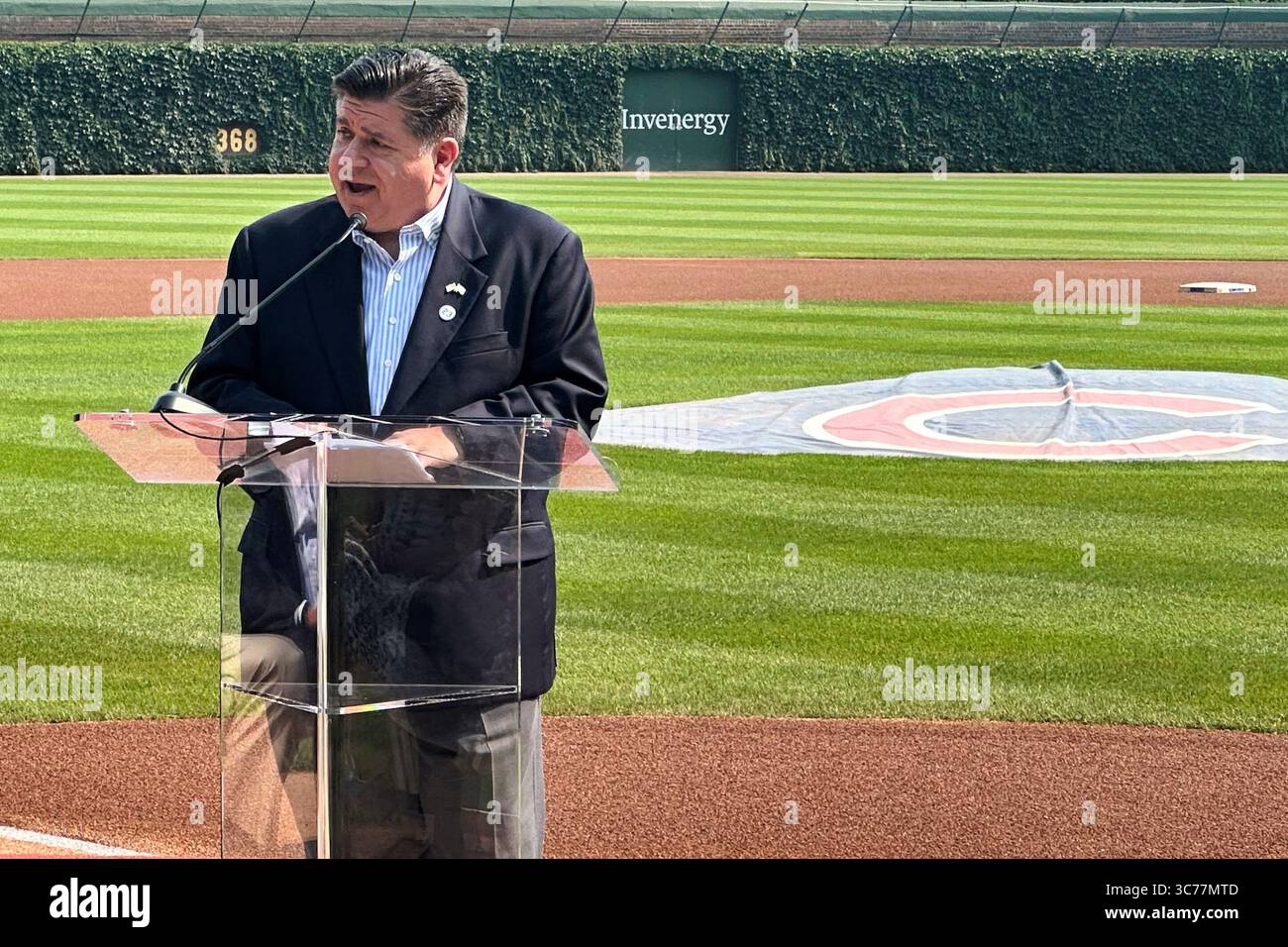 Illinois Gov. JB Pritzker speaks during a baseball news conference ...