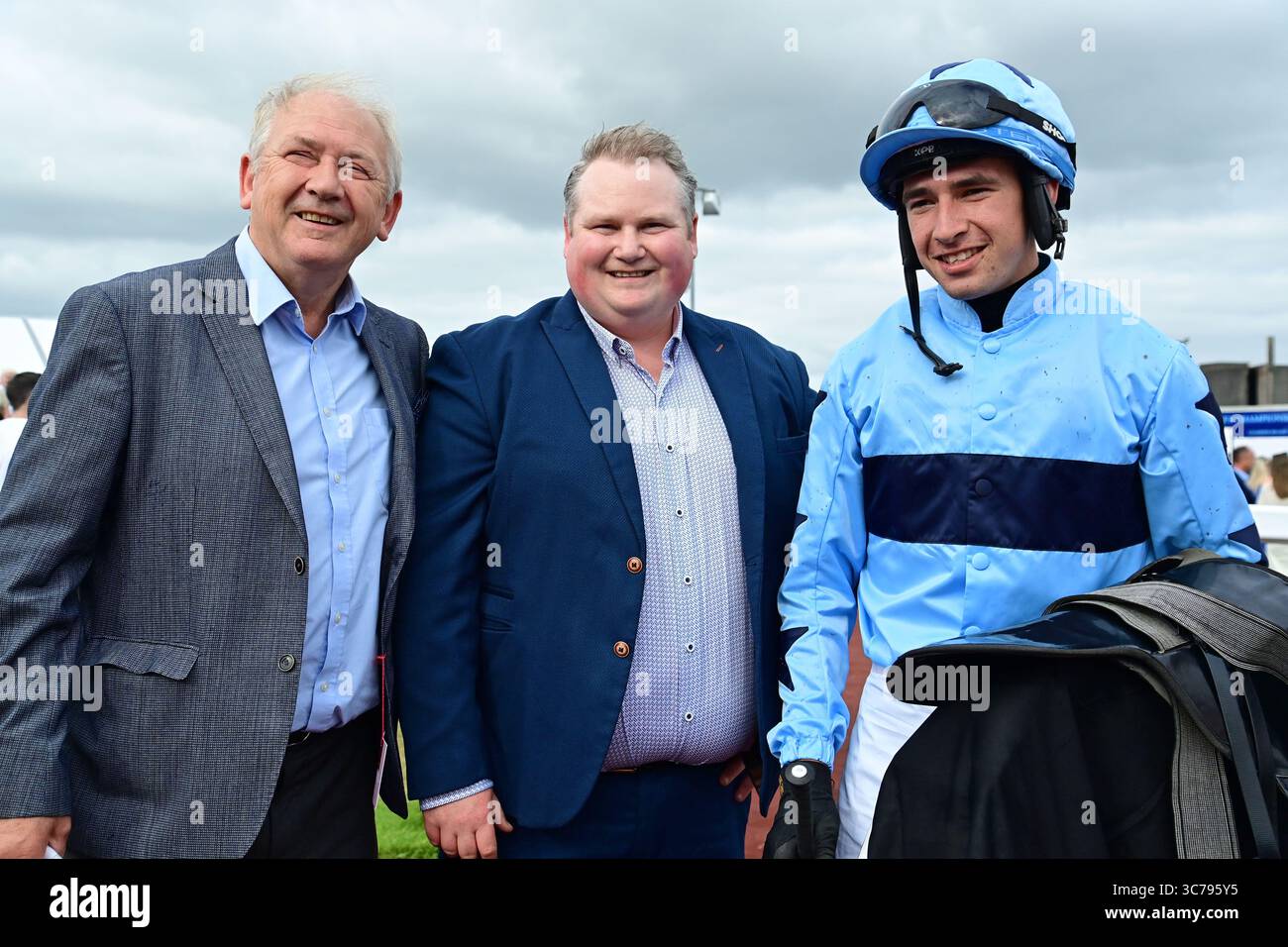Jockey Philip Byrnes (right) with trainer Charles Cathal after victory ...