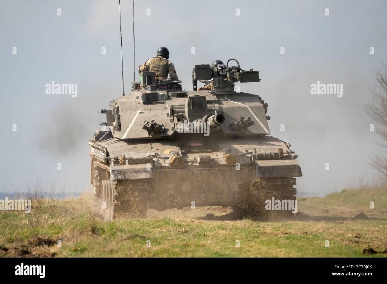 close-up of Commander and gunner directing a British army FV4034 ...