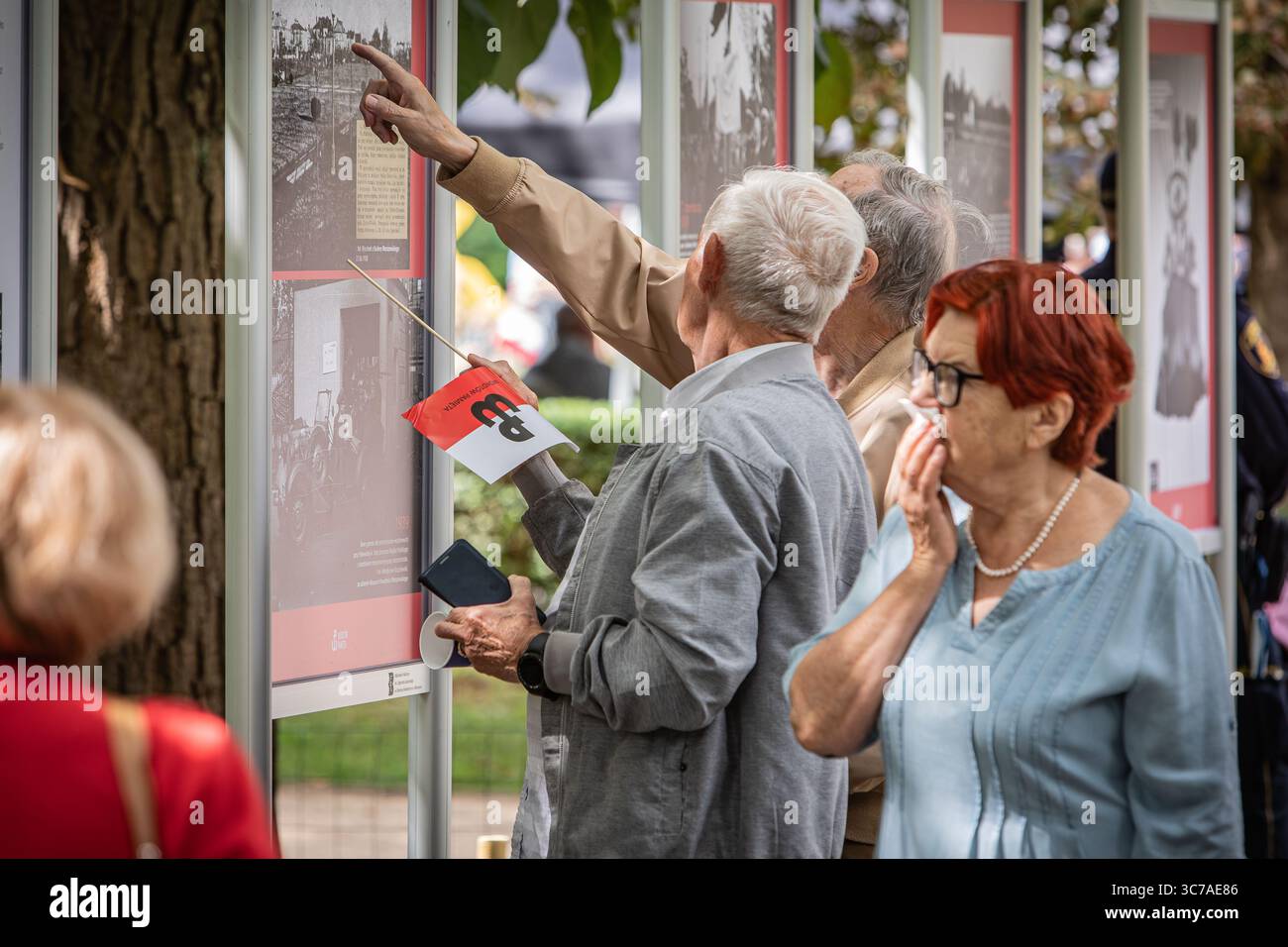 Warsaw, Poland. 1st Aug 2025. People looking at pictures during the ...