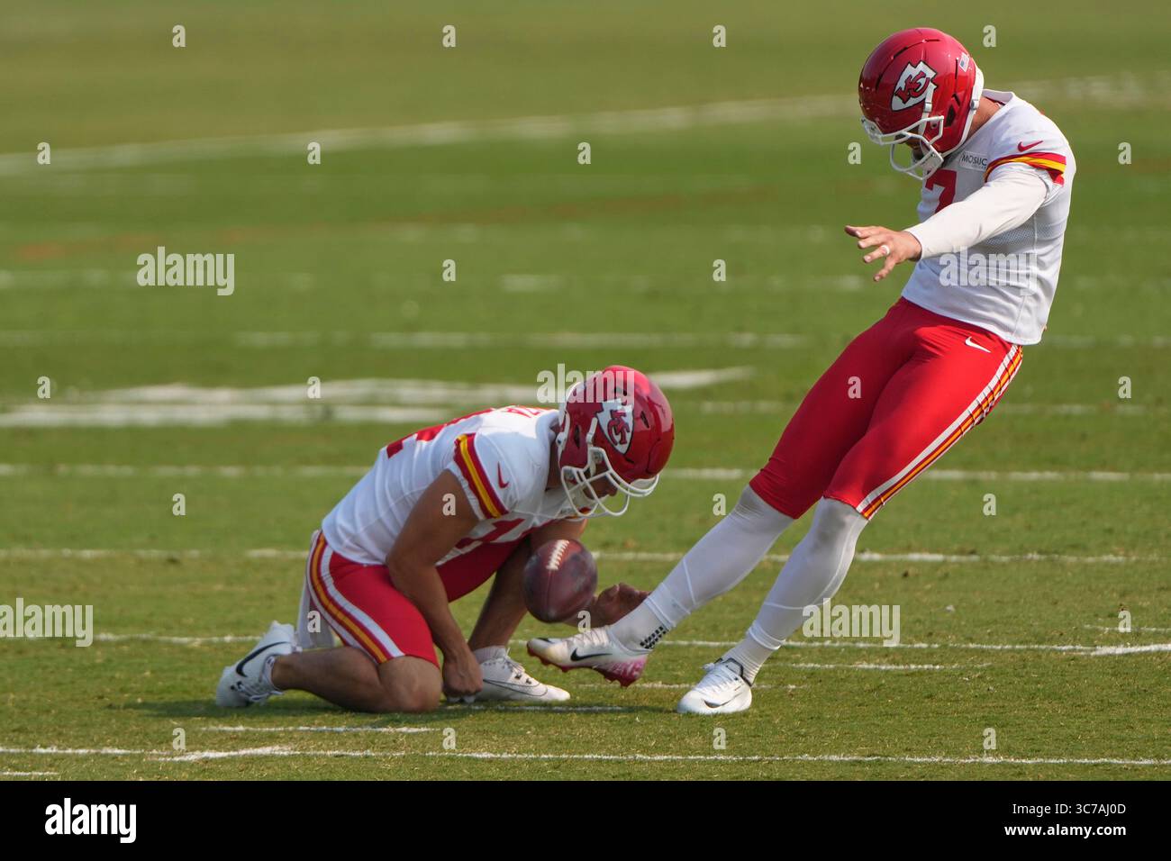 Kansas City Chiefs place kicker Harrison Butker (7) kicks the ball at ...