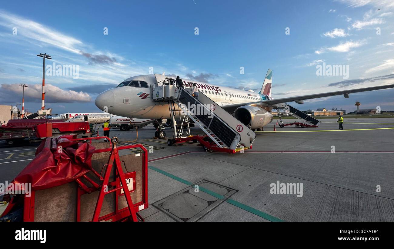 Eurowings Airbus A320 parked at remote stand at Hamburg Airport with ...