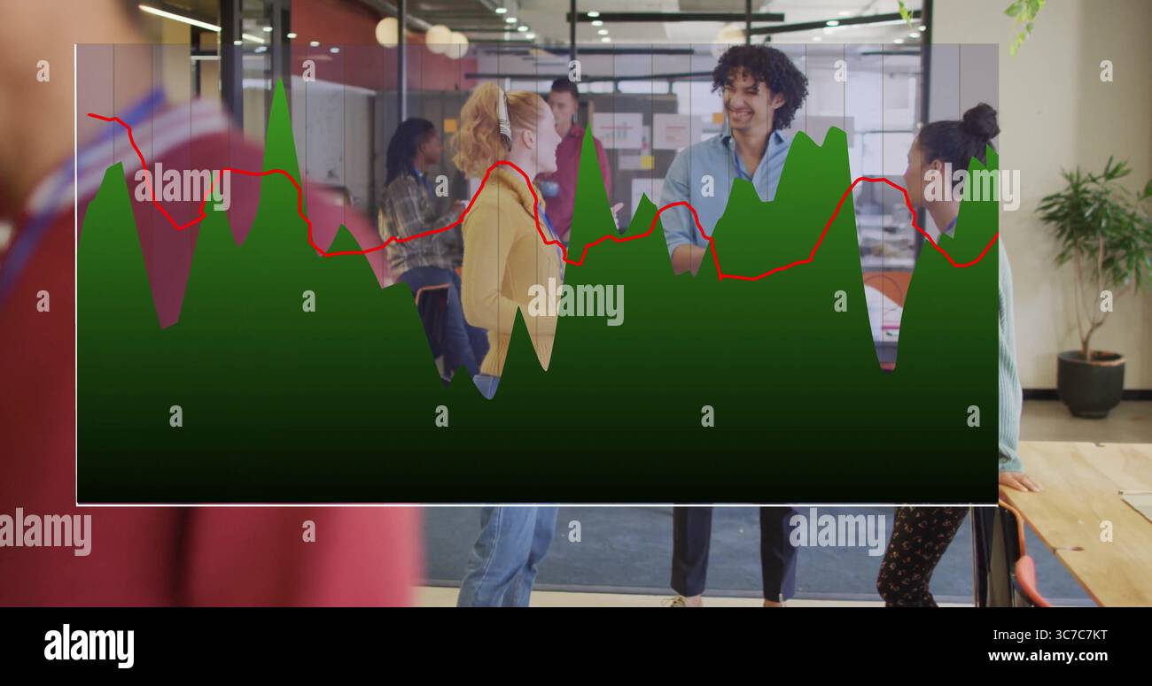 Collaborating coworkers wearing business attire standing around table ...