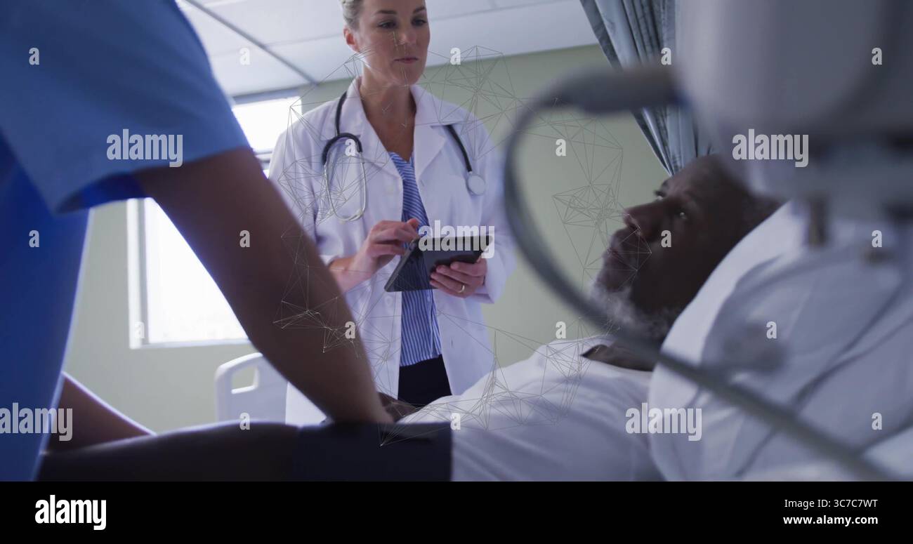 Medical team tapping tablet in hi-res stock photography and images - Alamy
