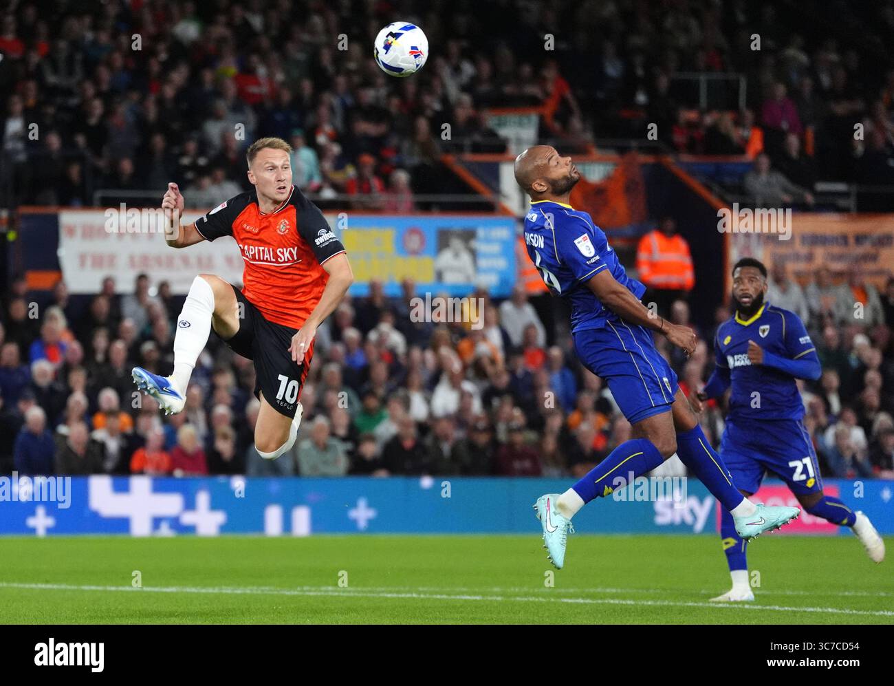 AFC Wimbledon's Ryan Johnson (right) scores an own goal to give Luton ...