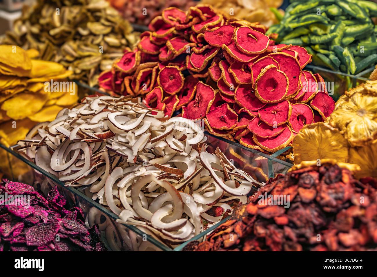 Piles of delicious Turkish dried fruit: coconut, pink apples, mango ...