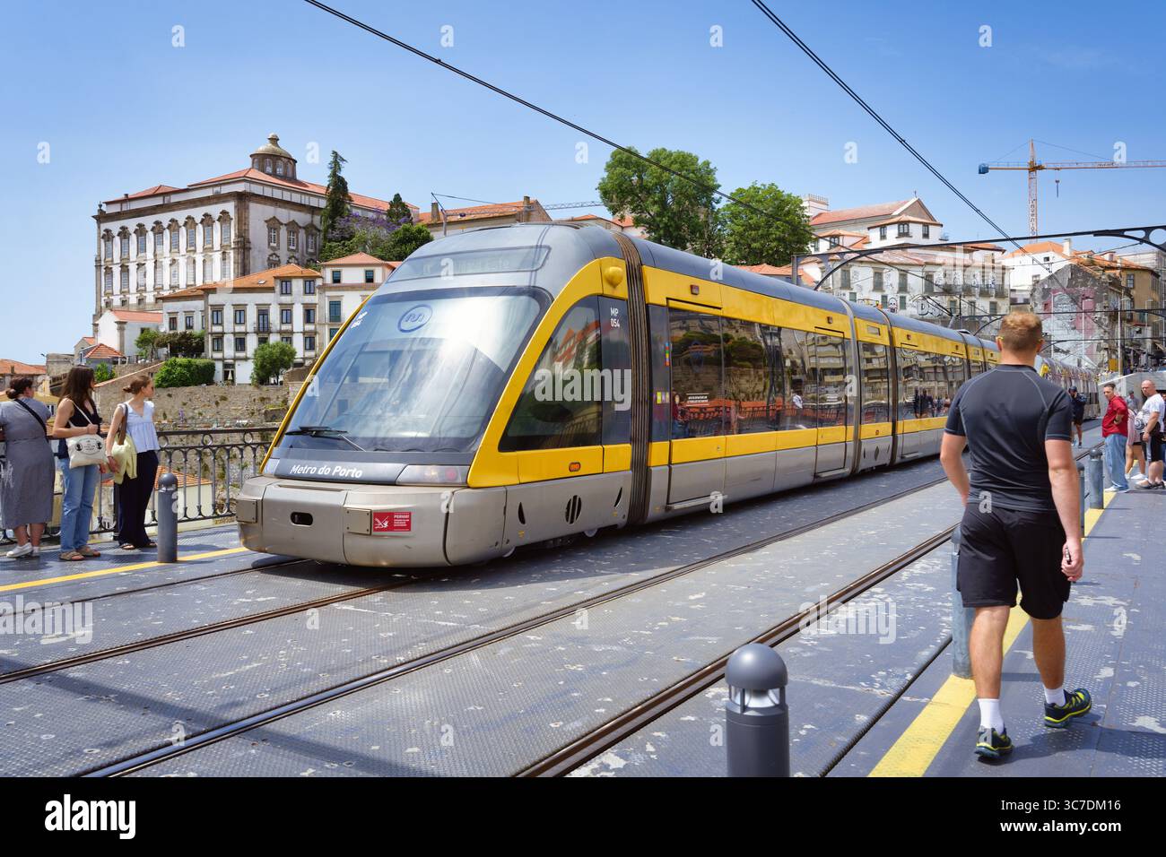 Porto, Portugal June 14 2025: A Metro do Porto train crosses the famous ...