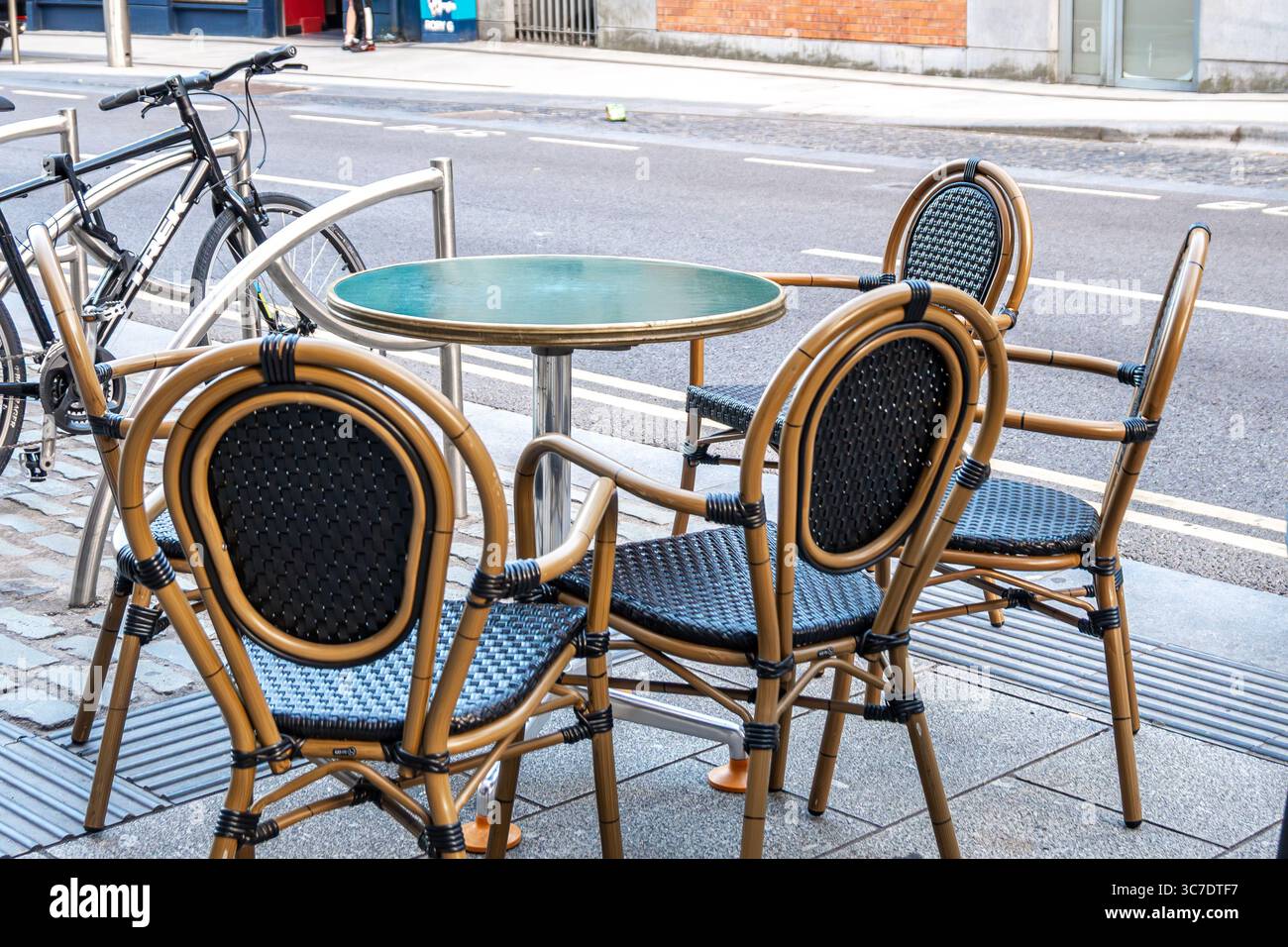 July 25, 2025 Cork, Ireland Charming and inviting Outdoor Cafe Seating ...