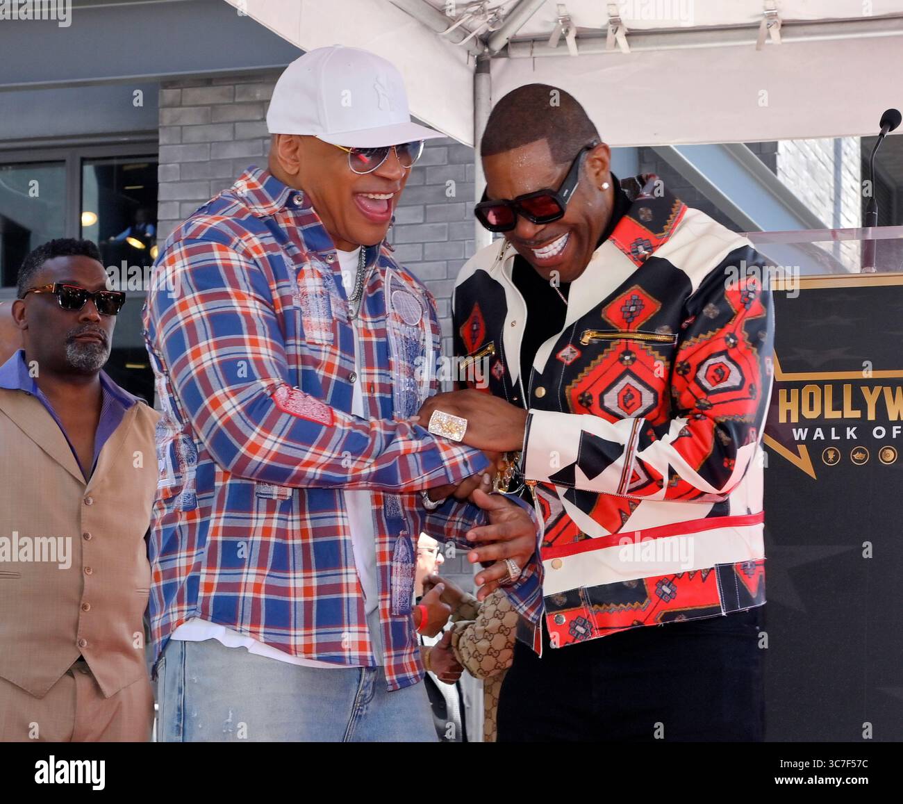 Hip-Hop icon Busta Rhymes is joined by LL Cool J (L) during an ...