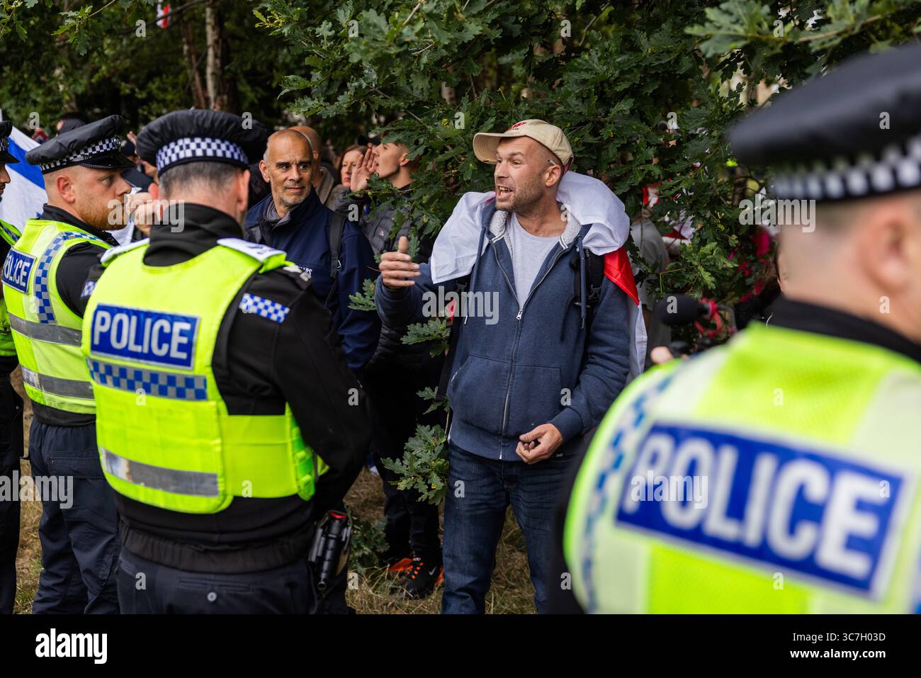 Leeds, UK. 01 AUG, 2025. Man shouts towards counter protestors as ...