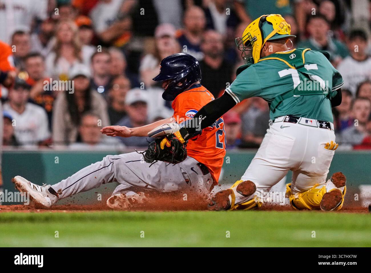 Houston Astros' Chas McCormick, left, is tagged out by Boston Red Sox ...