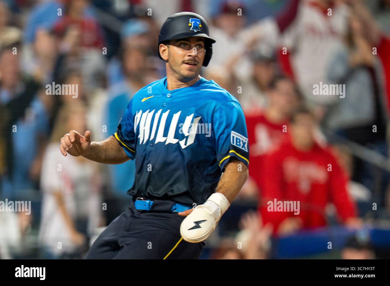 Philadelphia Phillies' Otto Kemp reacts as he scores on a single hit by ...