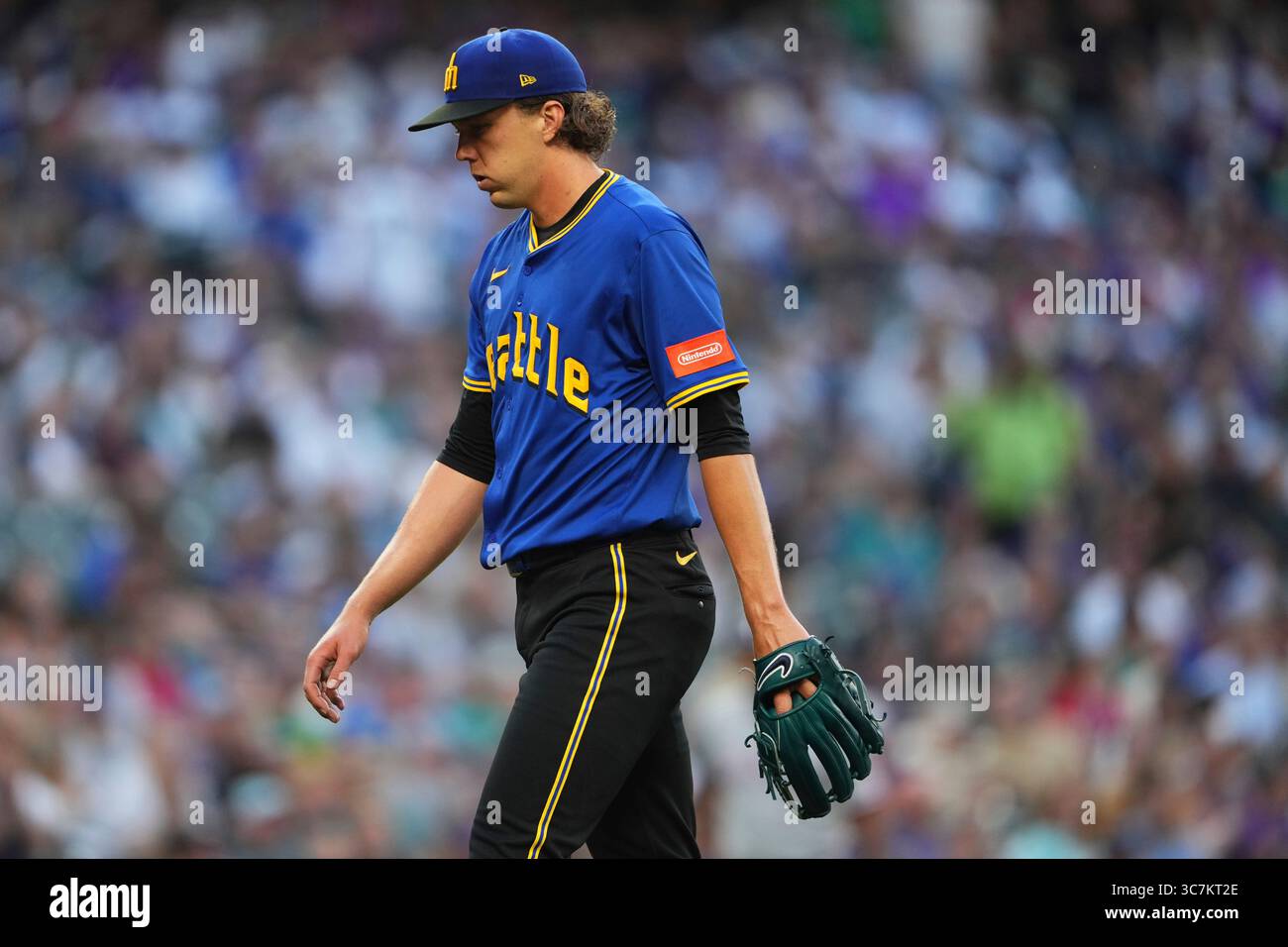 Seattle Mariners starting pitcher Logan Gilbert walks back to the ...