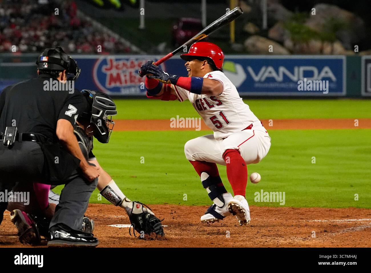 Los Angeles Angels' Gustavo Campero, right, is hit by a pitch as ...