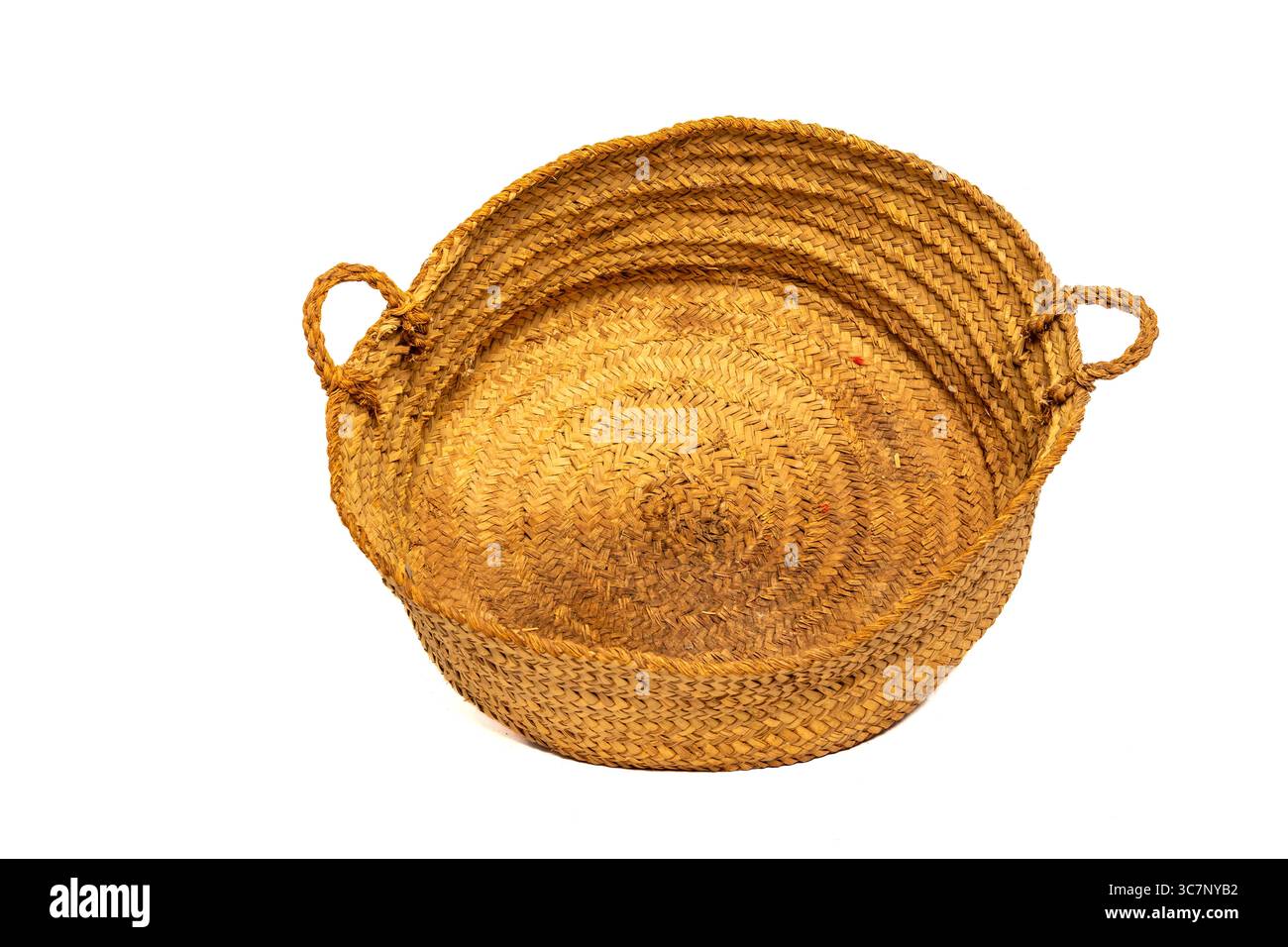 Top-down view of a large round basket made from dried palm fibers ...