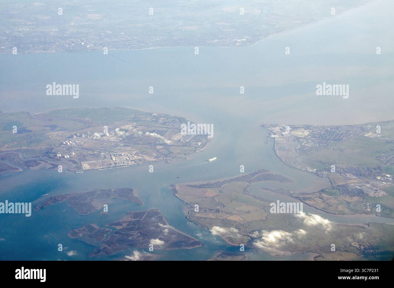 Aerial view of the estuary of the River Thames with the Isle of Grain ...