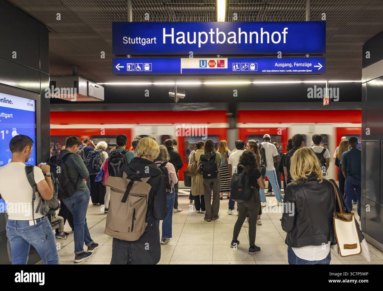 Stuttgart main station with S-Bahn. People on the platform waiting for ...