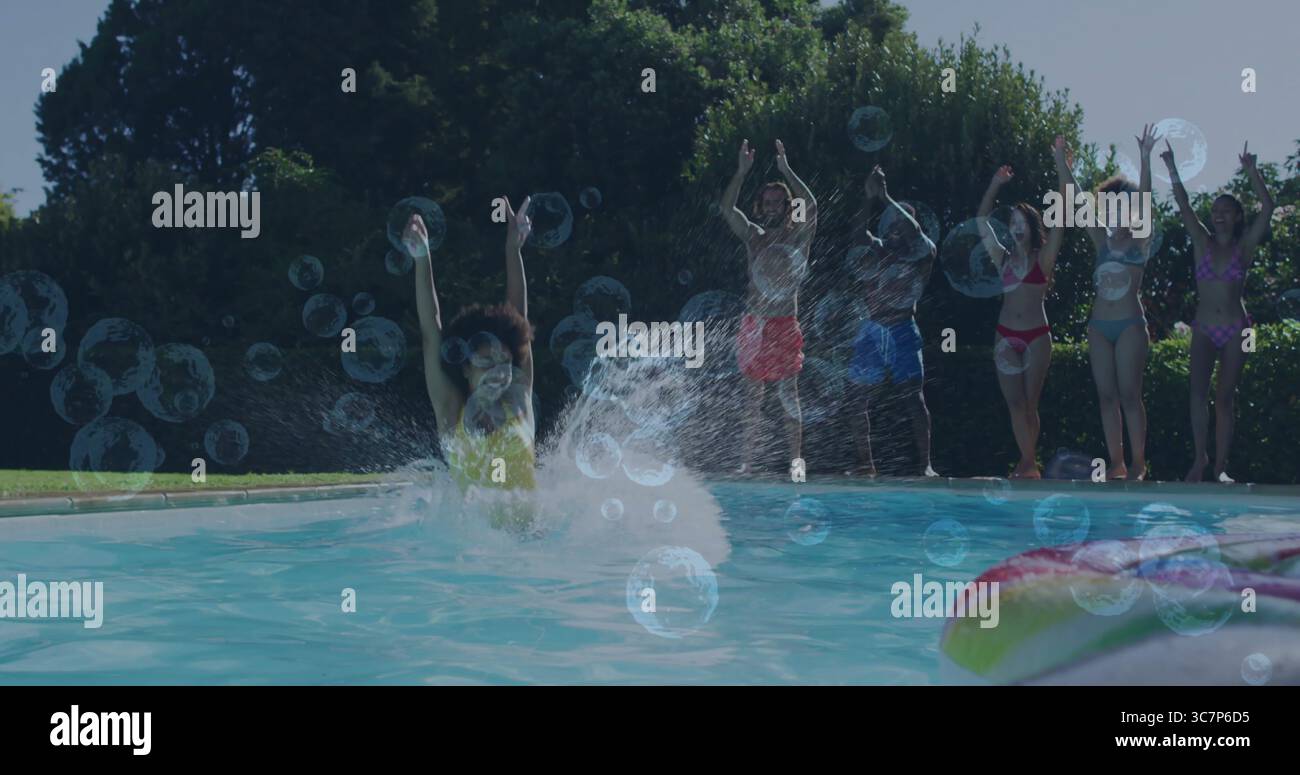 Jumping woman in yellow bikini creating splash at backyard pool, with ...