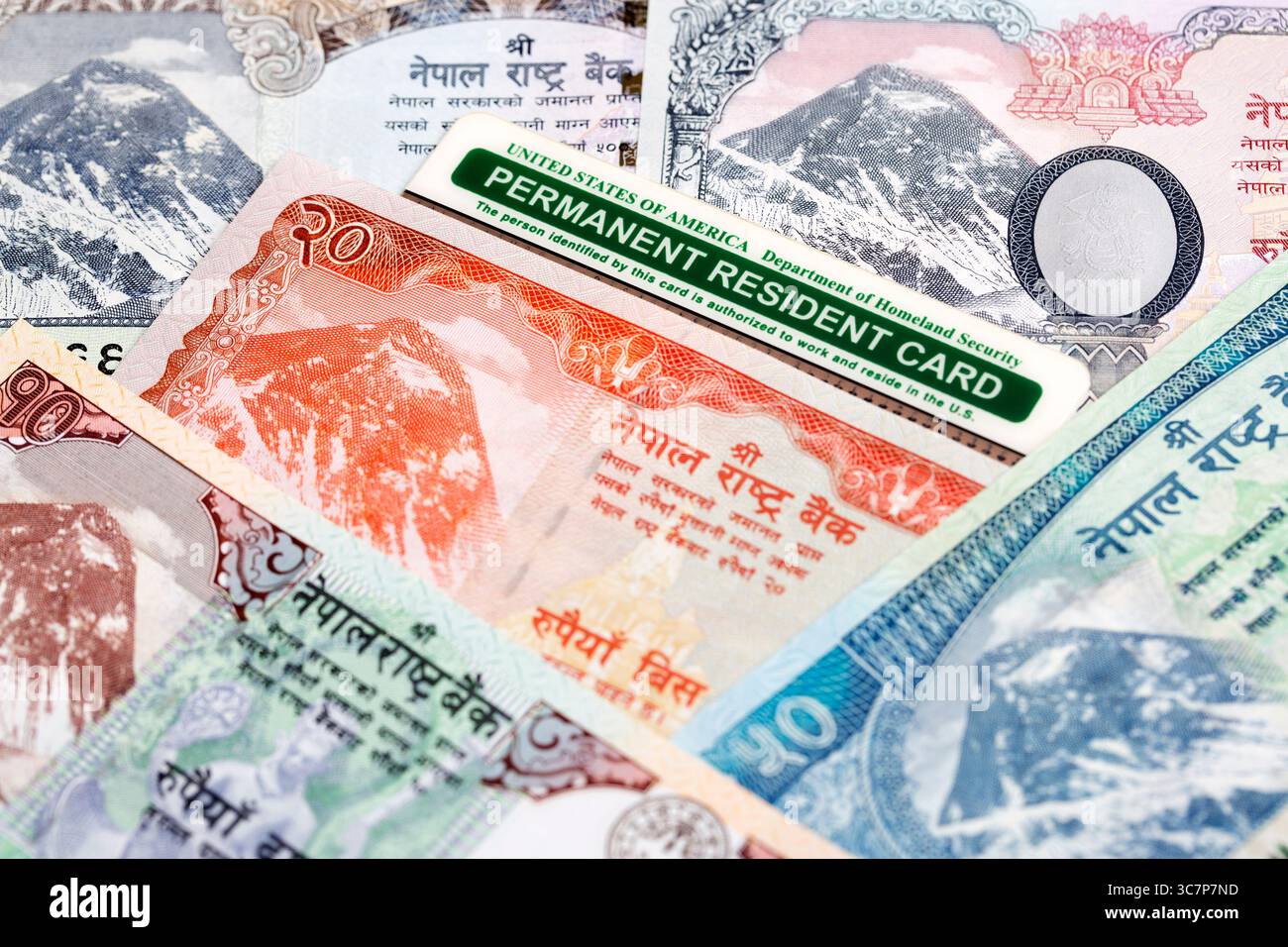 American Permanent Resident Card on Nepalese money - rupee Stock Photo ...