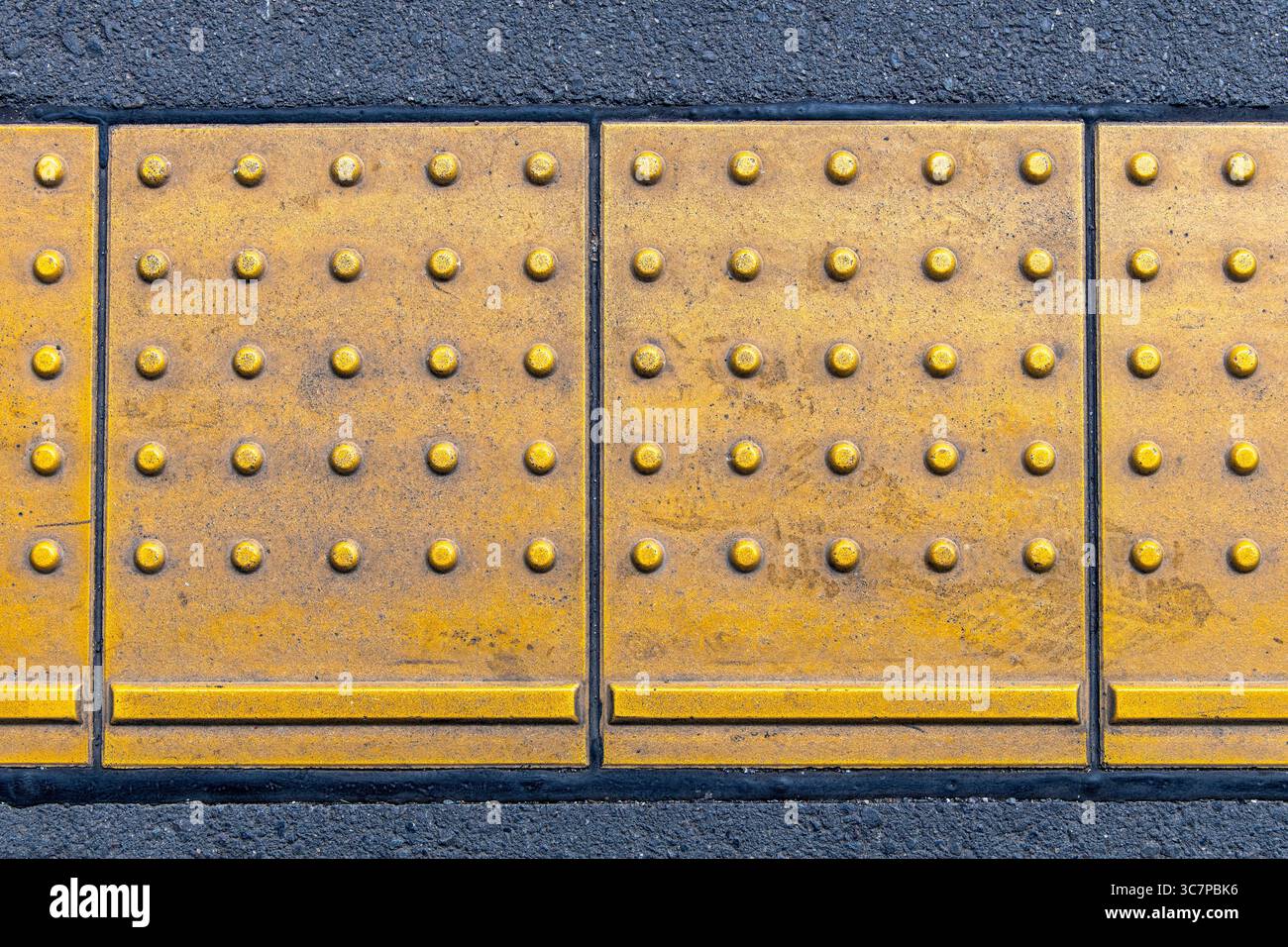Close up of yellow Tactile paving (also tenji blocks, after name for ...