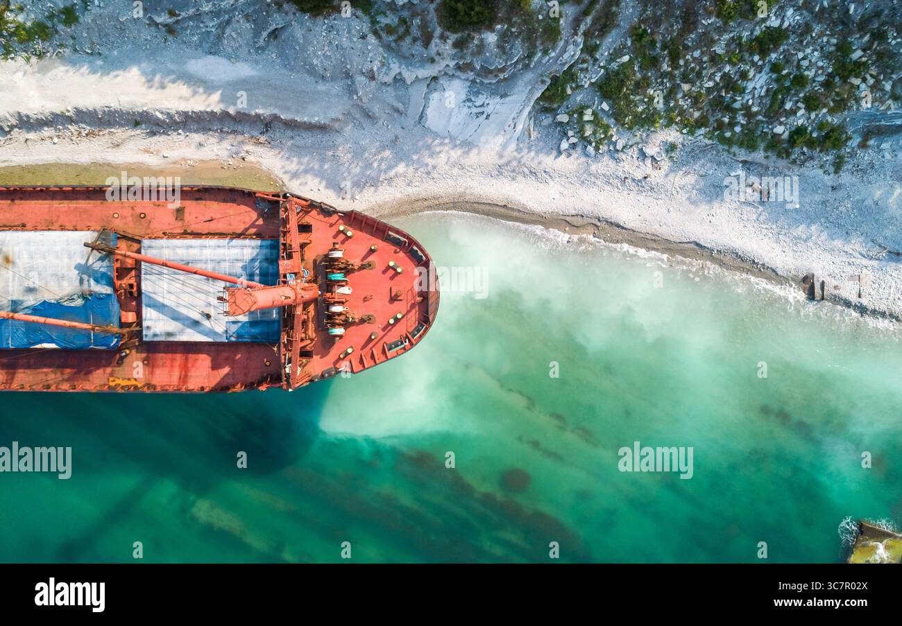 Aerial top down view of a bow part of an abandoned bulk-carrier dry ...